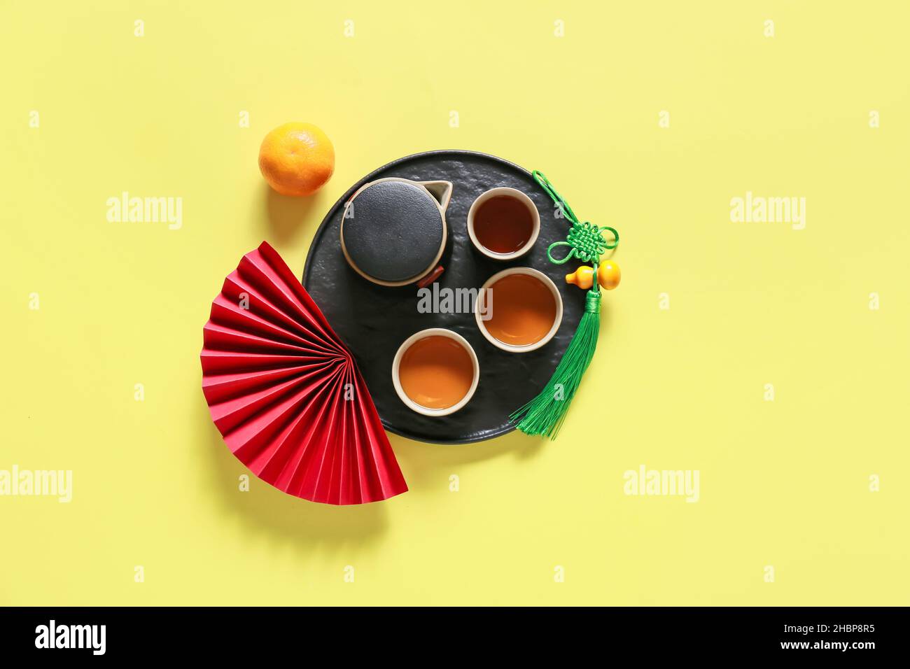 Traditional tea with Chinese symbols on yellow background Stock Photo ...