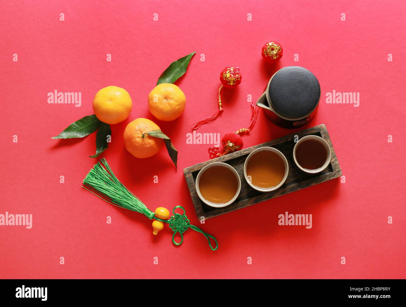 Traditional tea with Chinese symbols on red background Stock Photo - Alamy
