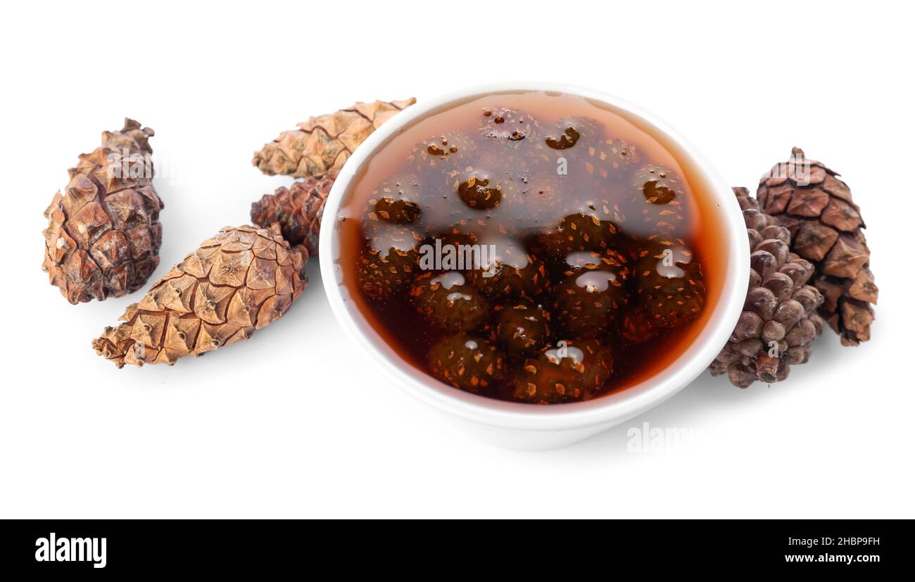 Bowl of tasty pine cone jam on white background Stock Photo - Alamy