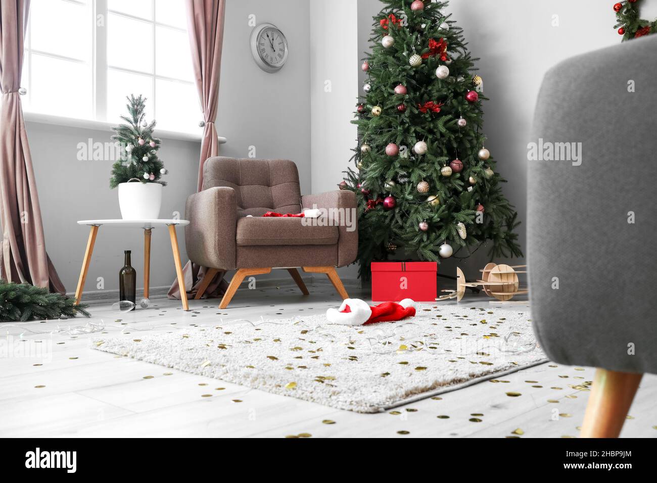 Interior of messy room after Christmas celebration Stock Photo - Alamy