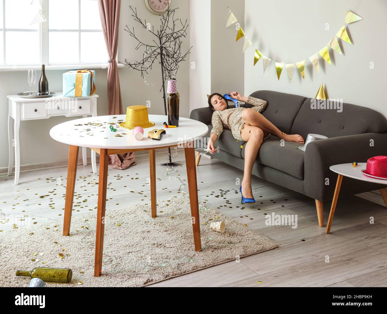 Drunk young woman sleeping after Christmas party at home Stock Photo ...