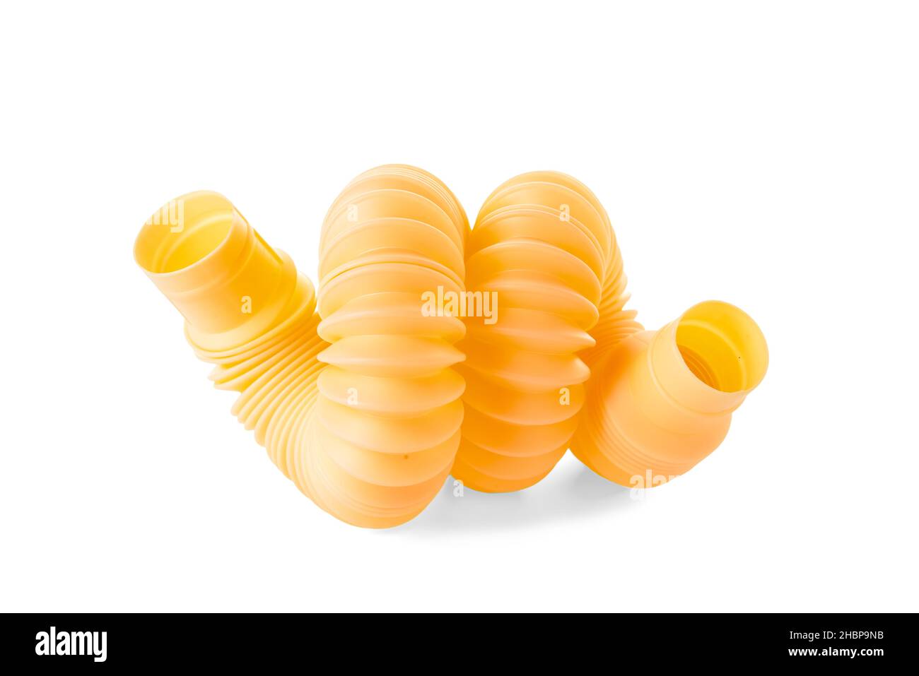 Orange Pop Tube on white background Stock Photo - Alamy