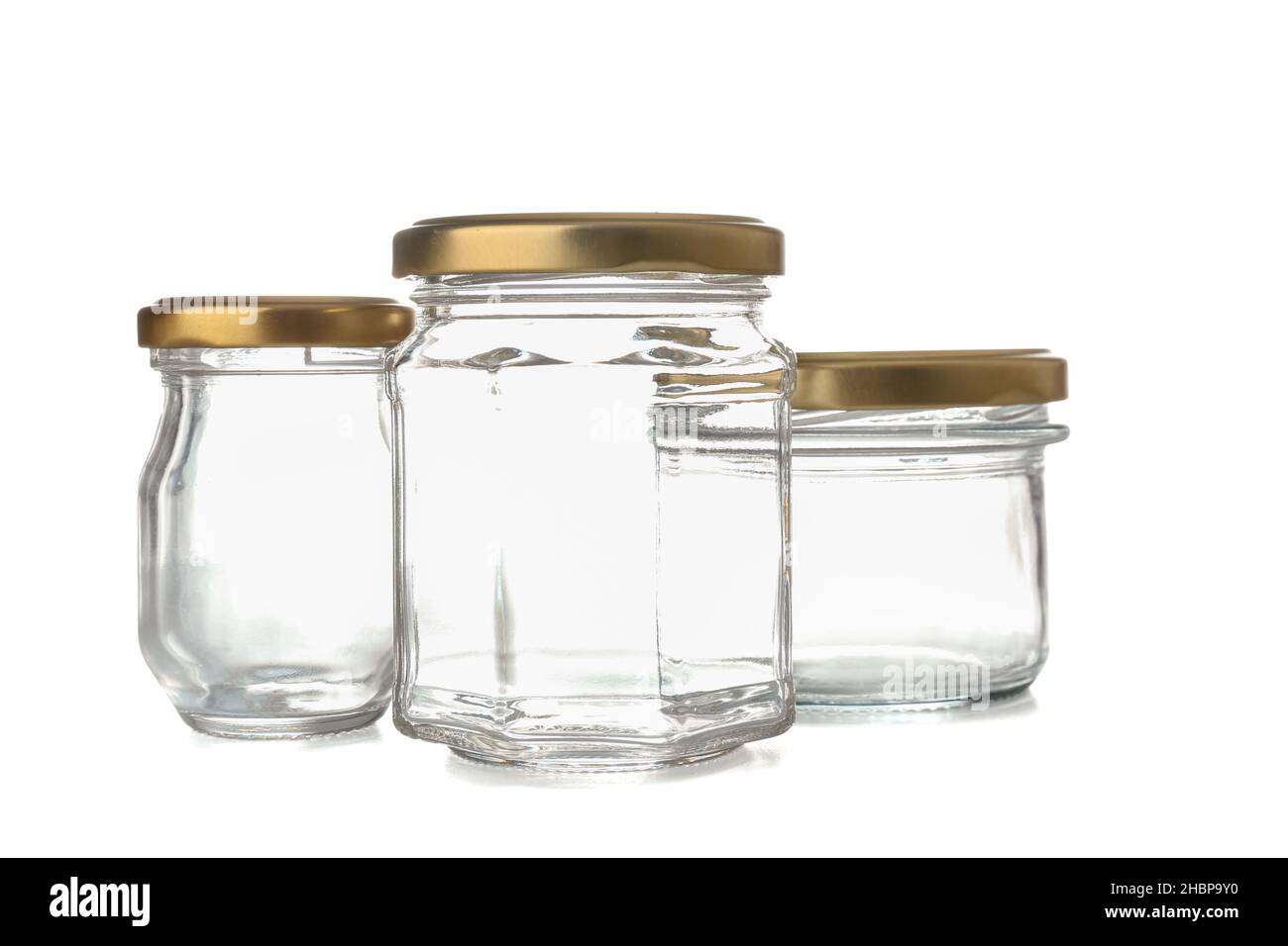 Three jars on white background Stock Photo - Alamy