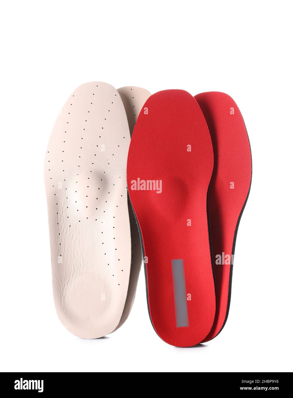 Beige and red orthopedic insoles on white background Stock Photo - Alamy