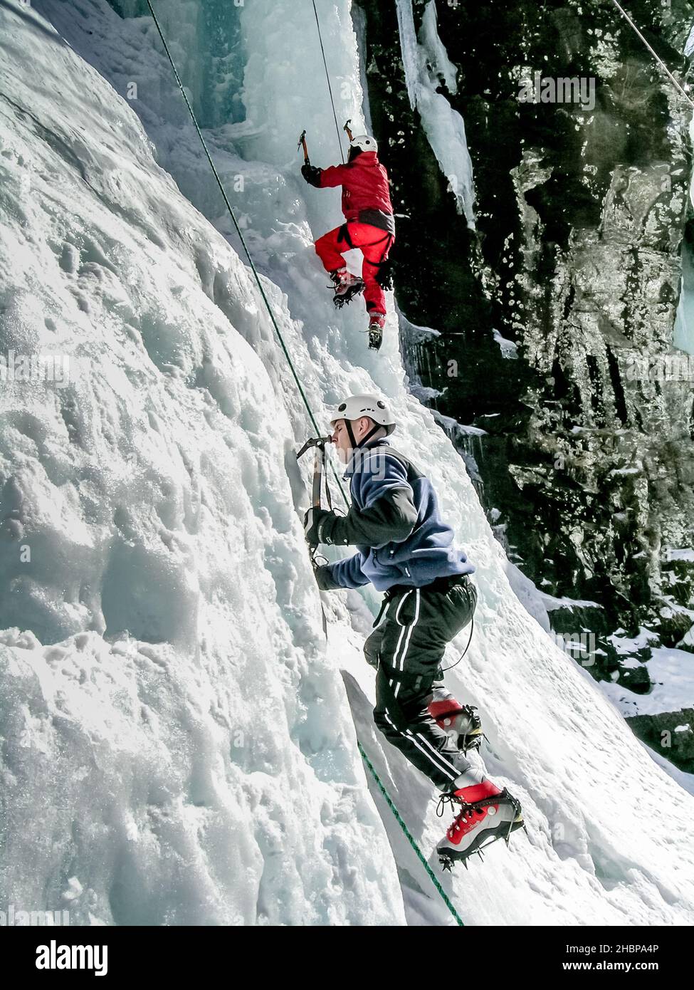 Man climbing steep ice hi-res stock photography and images - Alamy