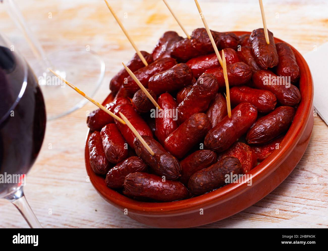 Spanish appetizer, warm mini chorizo sausages Stock Photo - Alamy