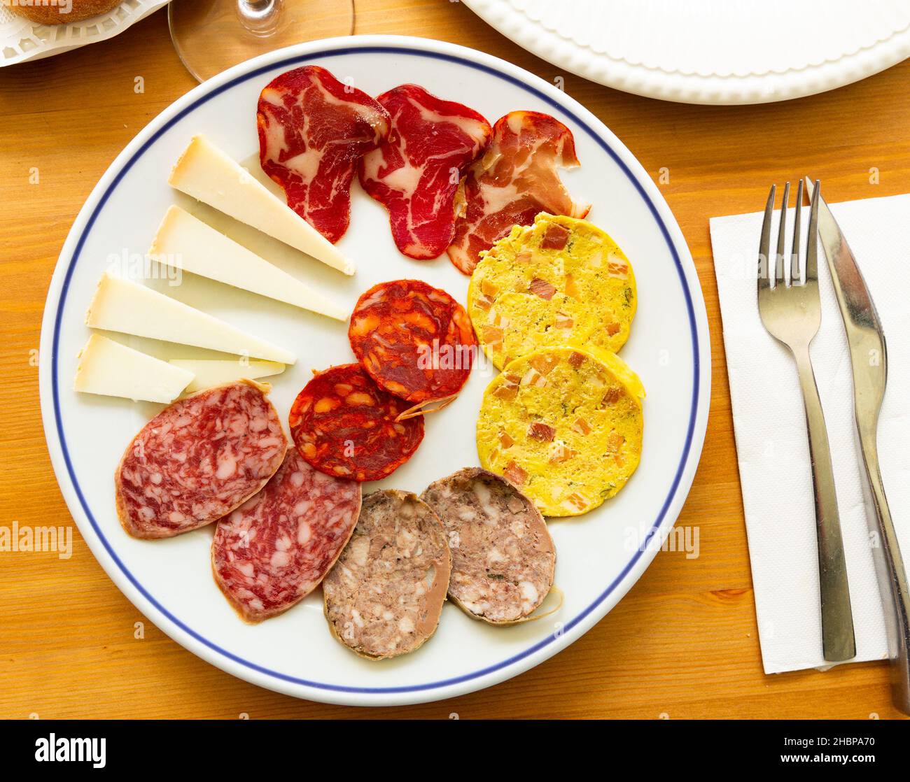Traditional spanish snack tapas on a plate Stock Photo - Alamy