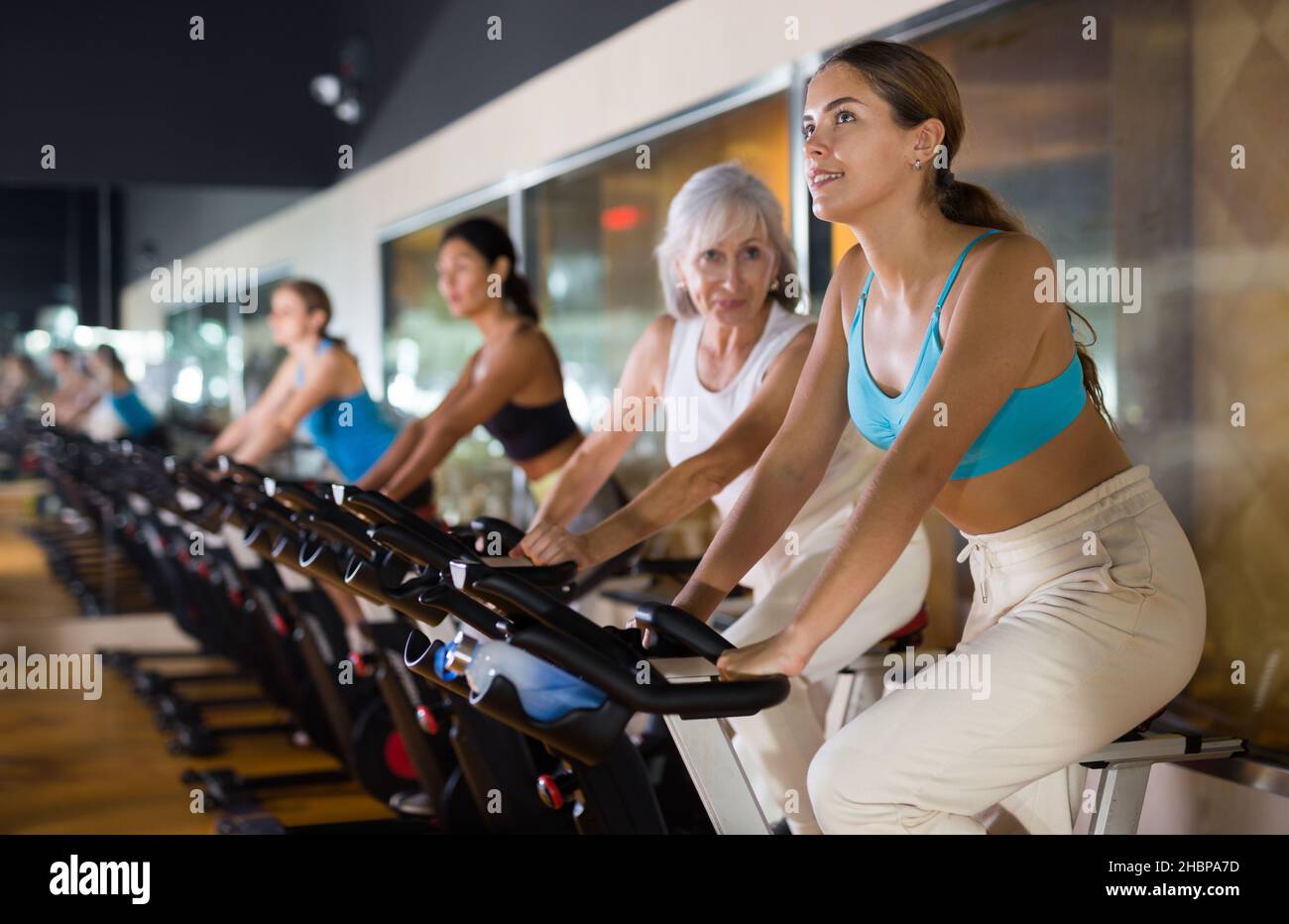 Girl exercise bike fitness health woman slim cycling hi-res stock ...