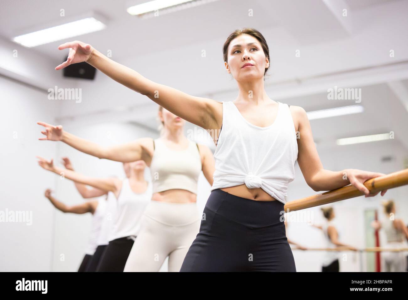 Row of female ballet dancers in studio Stock Photo - Alamy