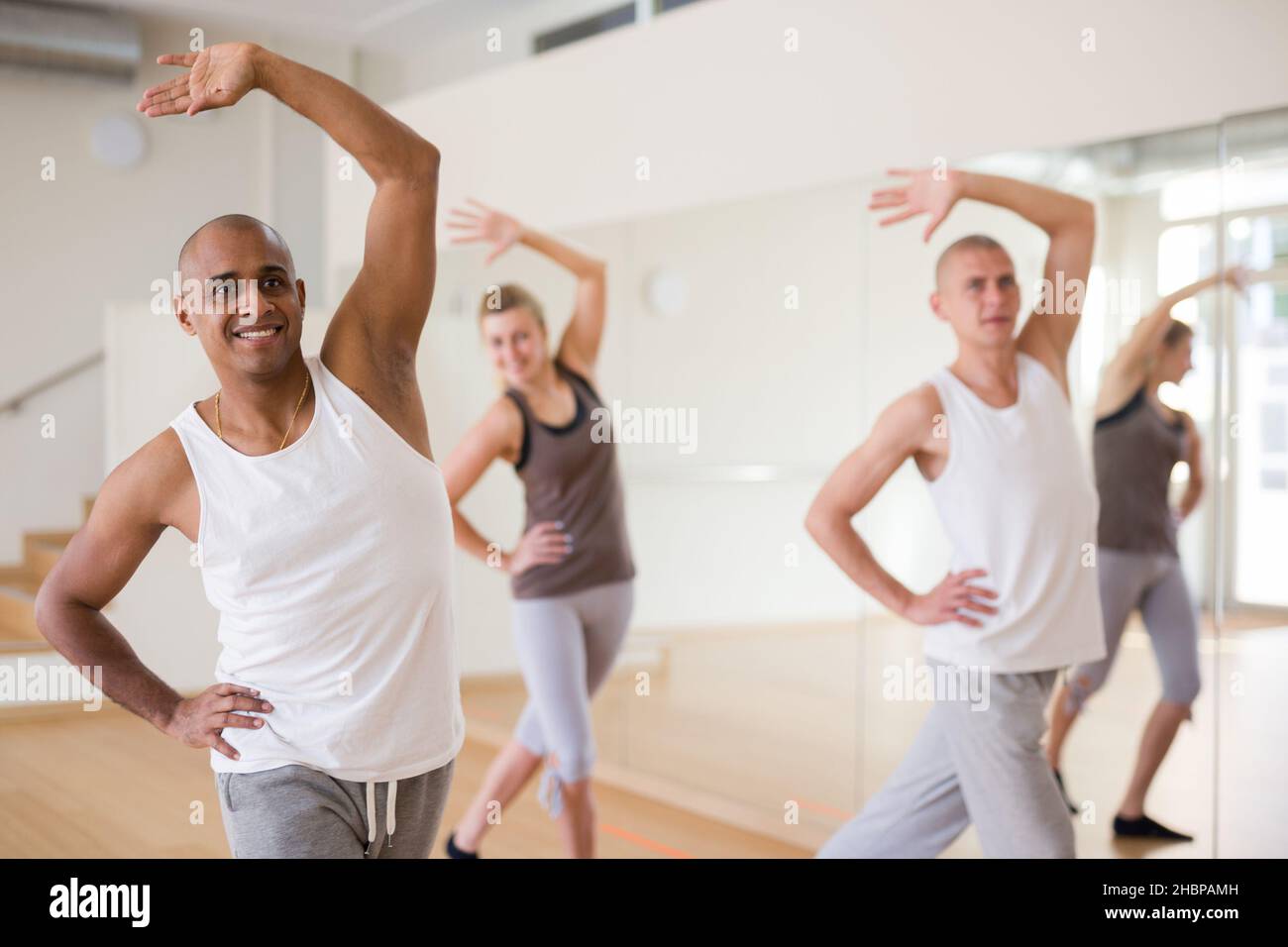 Man dancing at group lesson in studio Stock Photo - Alamy