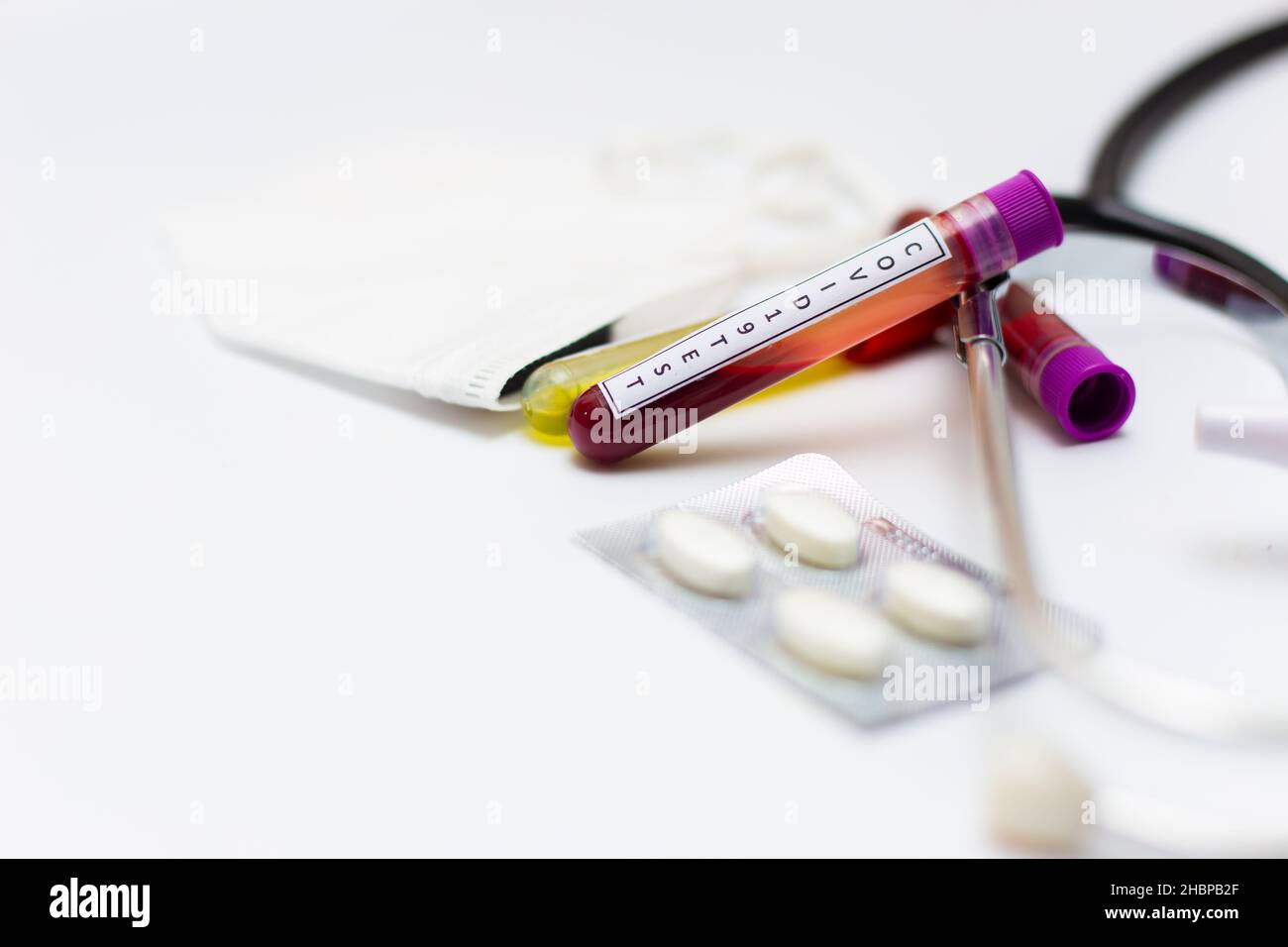 Microbiologist with a tube of biological blood sample contaminated by ...