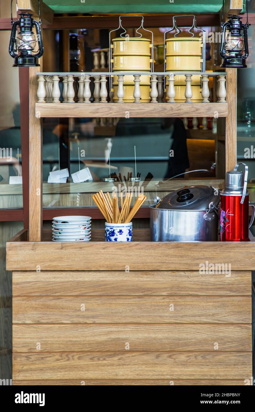 Front view vintage style noodle shop tone. Wooden counter display in ...