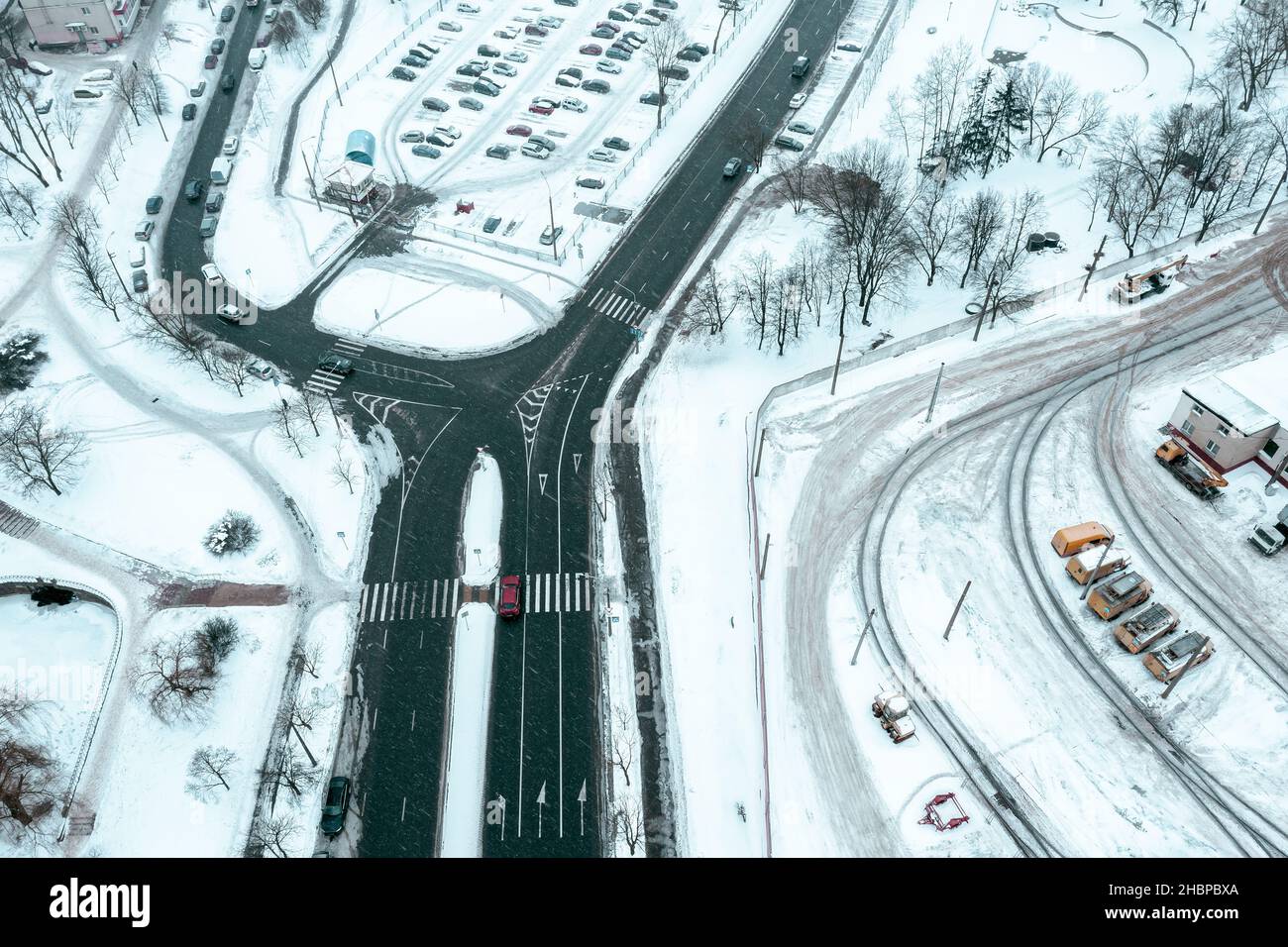 snow covered cars standing on parking lot during snowfall. winter ...