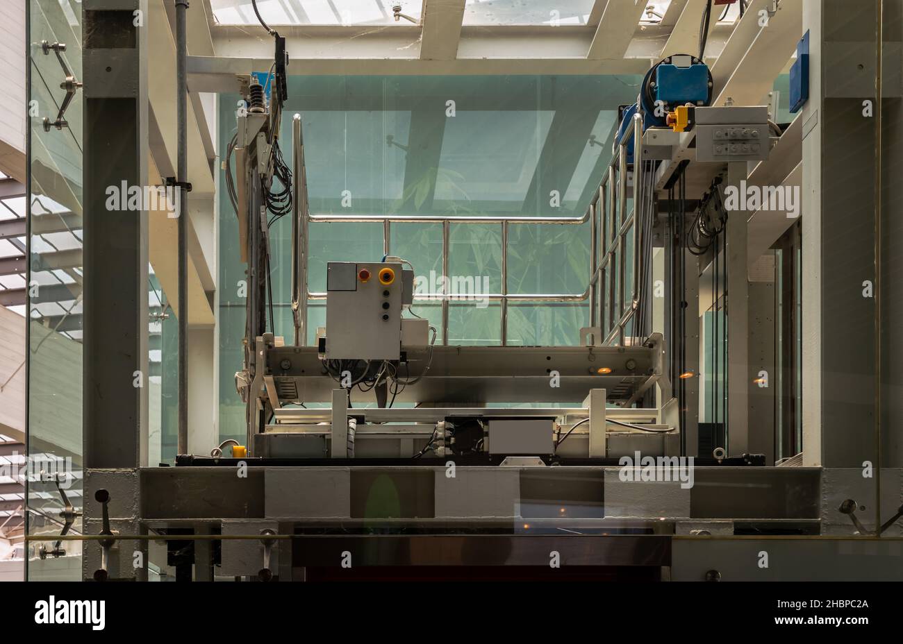 Elevator engine glass room with elevator motor. Motor driven Elevator ...