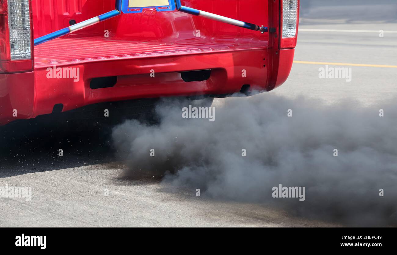 Air pollution from vehicle exhaust pipe on road Stock Photo - Alamy