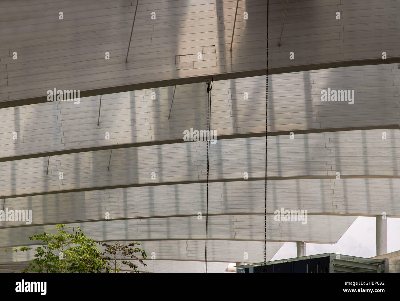 Burred light and shadow passing through architecture of Metal beams of ...
