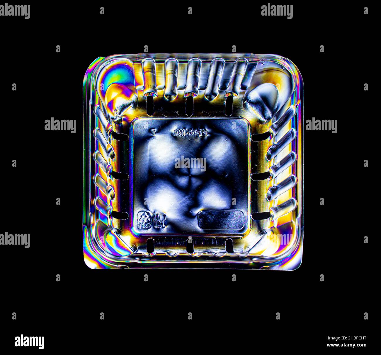 Stress patterns seen in a plastic box illuminated with polarised light ...