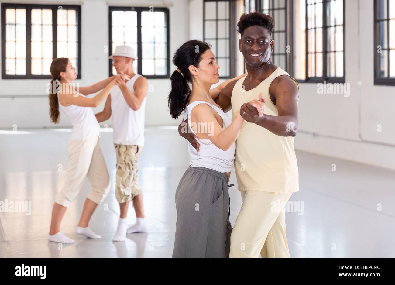 Dancing couples enjoying salsa hi-res stock photography and images - Alamy
