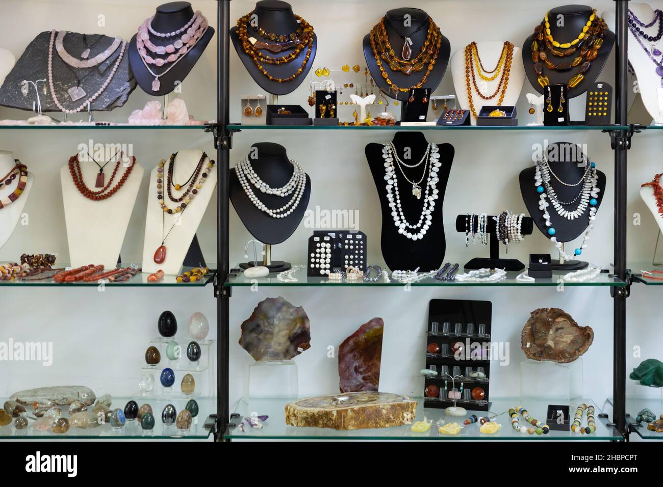 Semiprecious stones jewelry in showcase of shop Stock Photo - Alamy