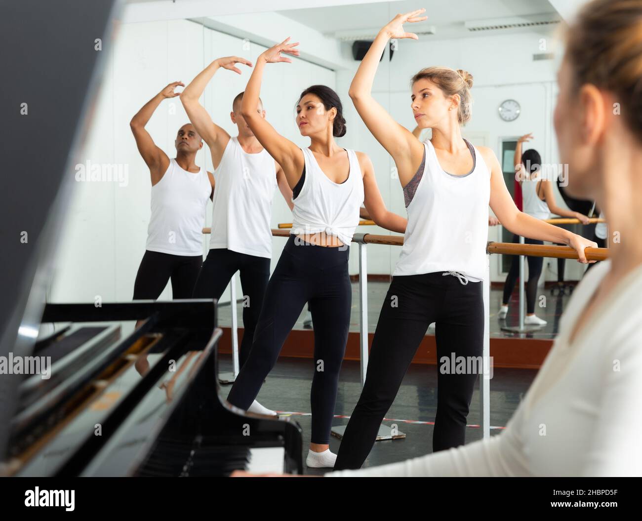 dancers doing exercises under live music Stock Photo - Alamy