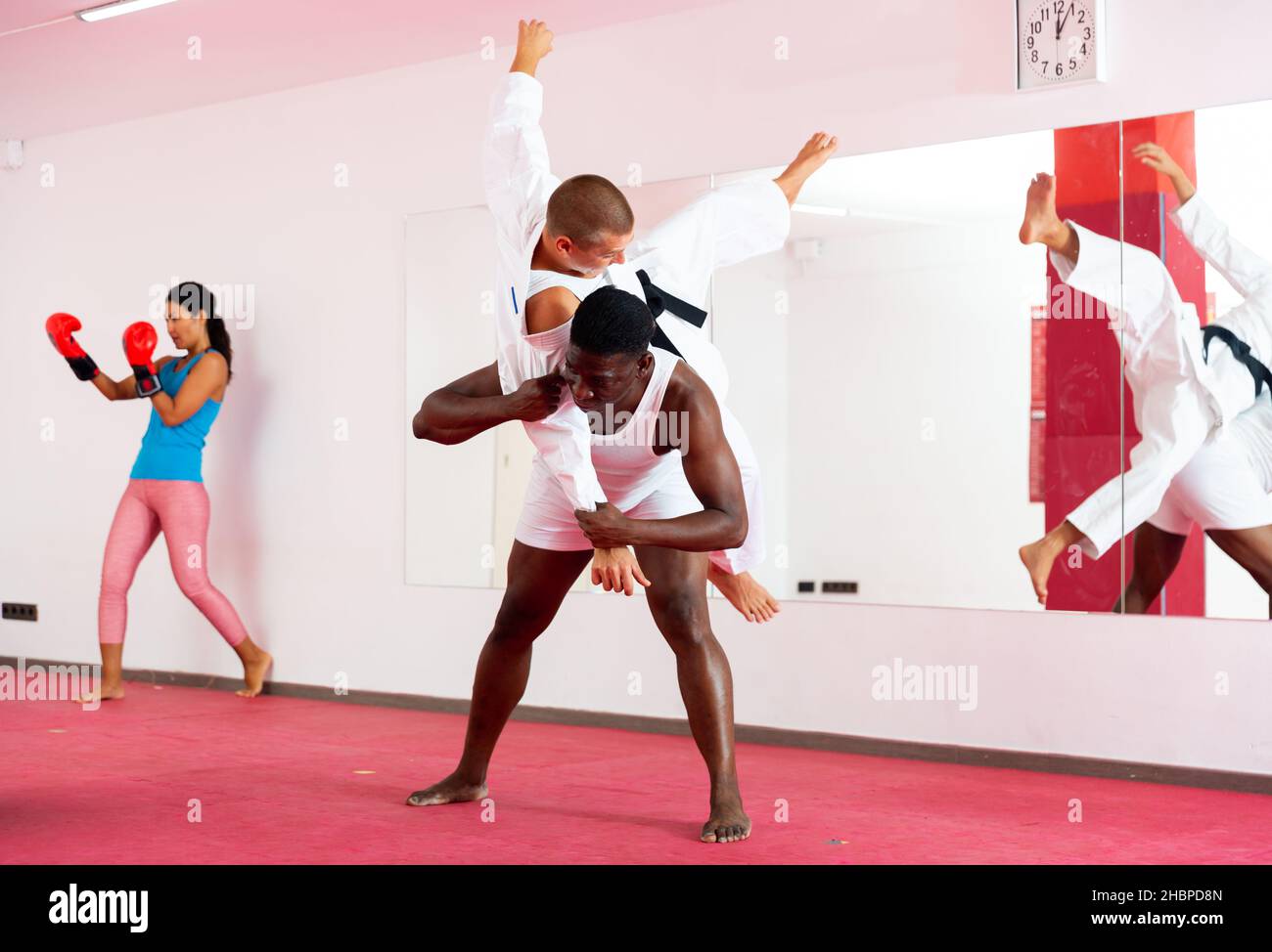 People training martial arts moves in gym Stock Photo - Alamy