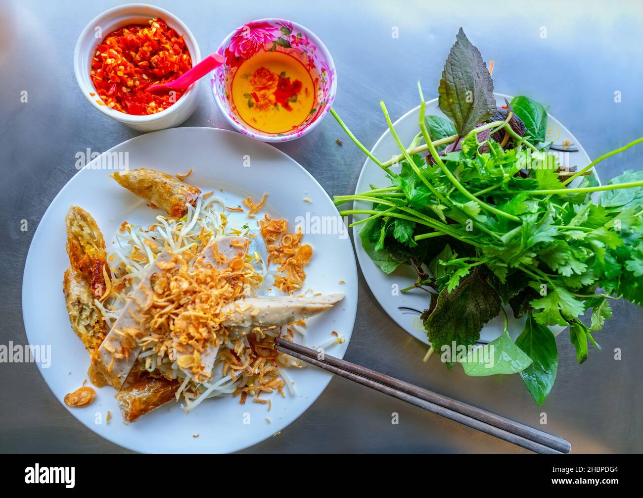 Steamed rolled rice pancake Vietnamese food with herbs and fish sauce ...