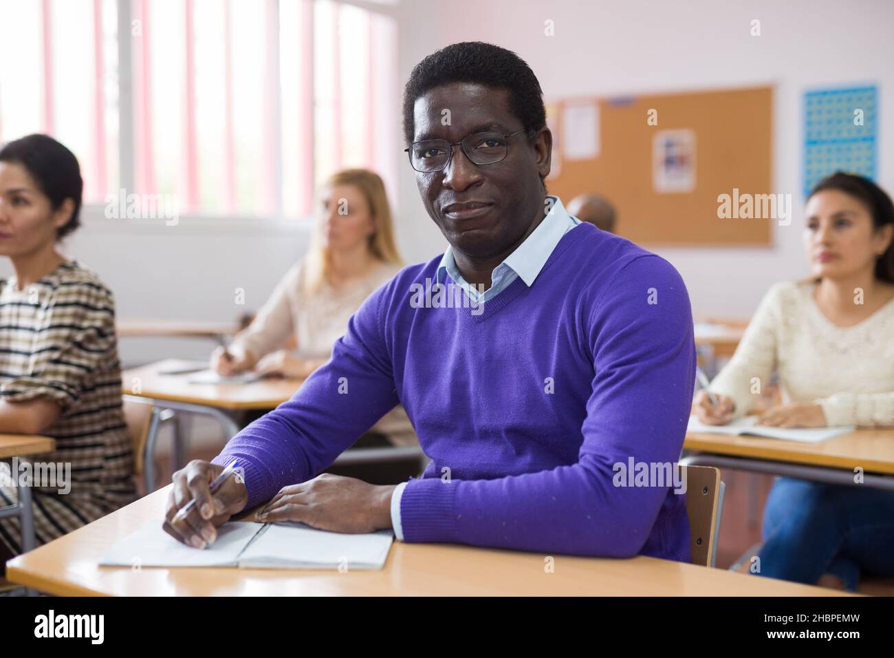 African-american student among students in classroom Stock Photo - Alamy