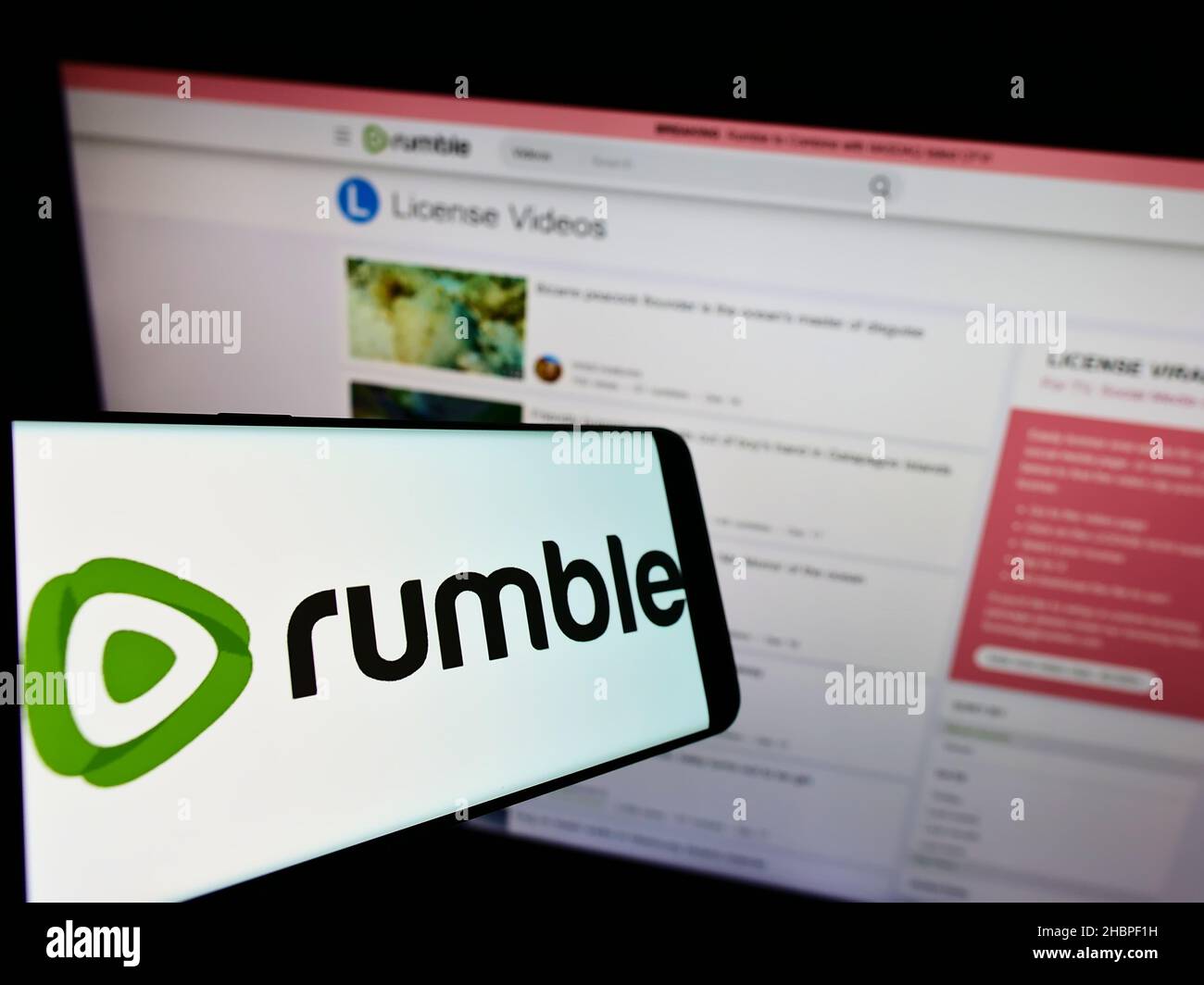 Mobile phone with logo of Canadian video platform company Rumble Inc ...
