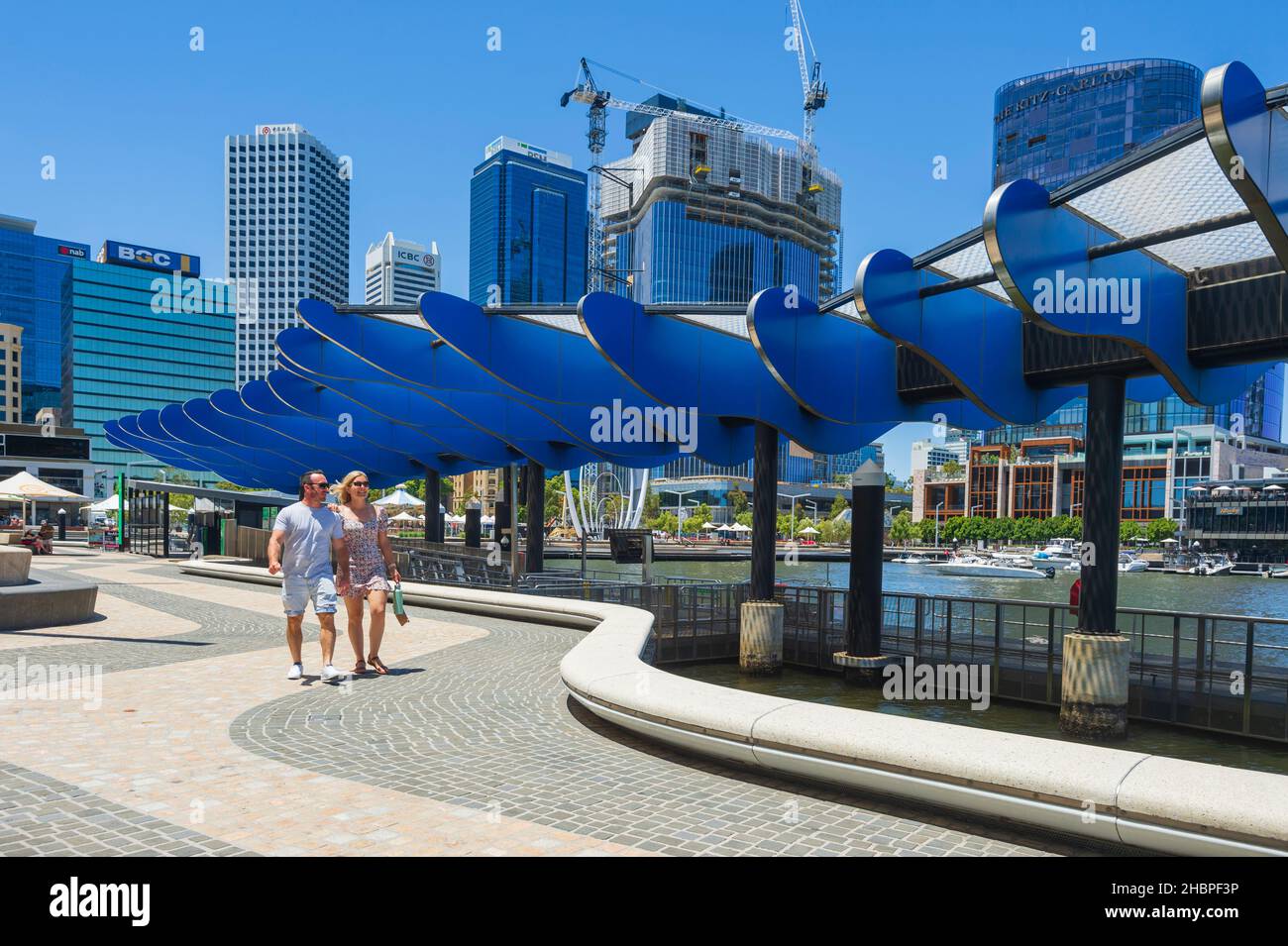 Couple walking on the foreshore at Elizabeth Quay, Perth, Western ...