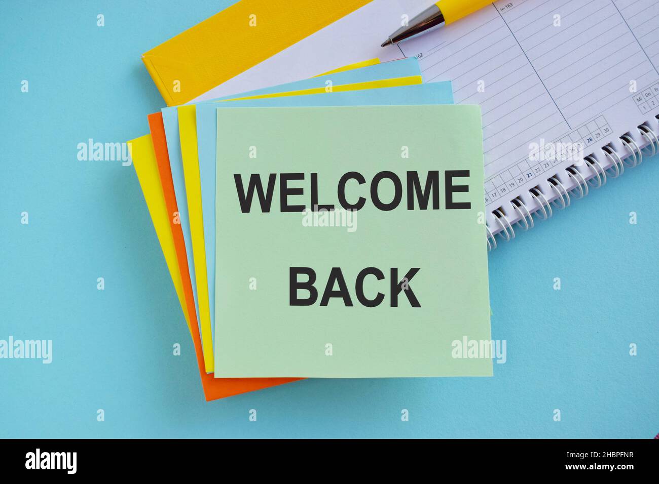 Welcome back sign - text inscription on colorful sticker, blue ...