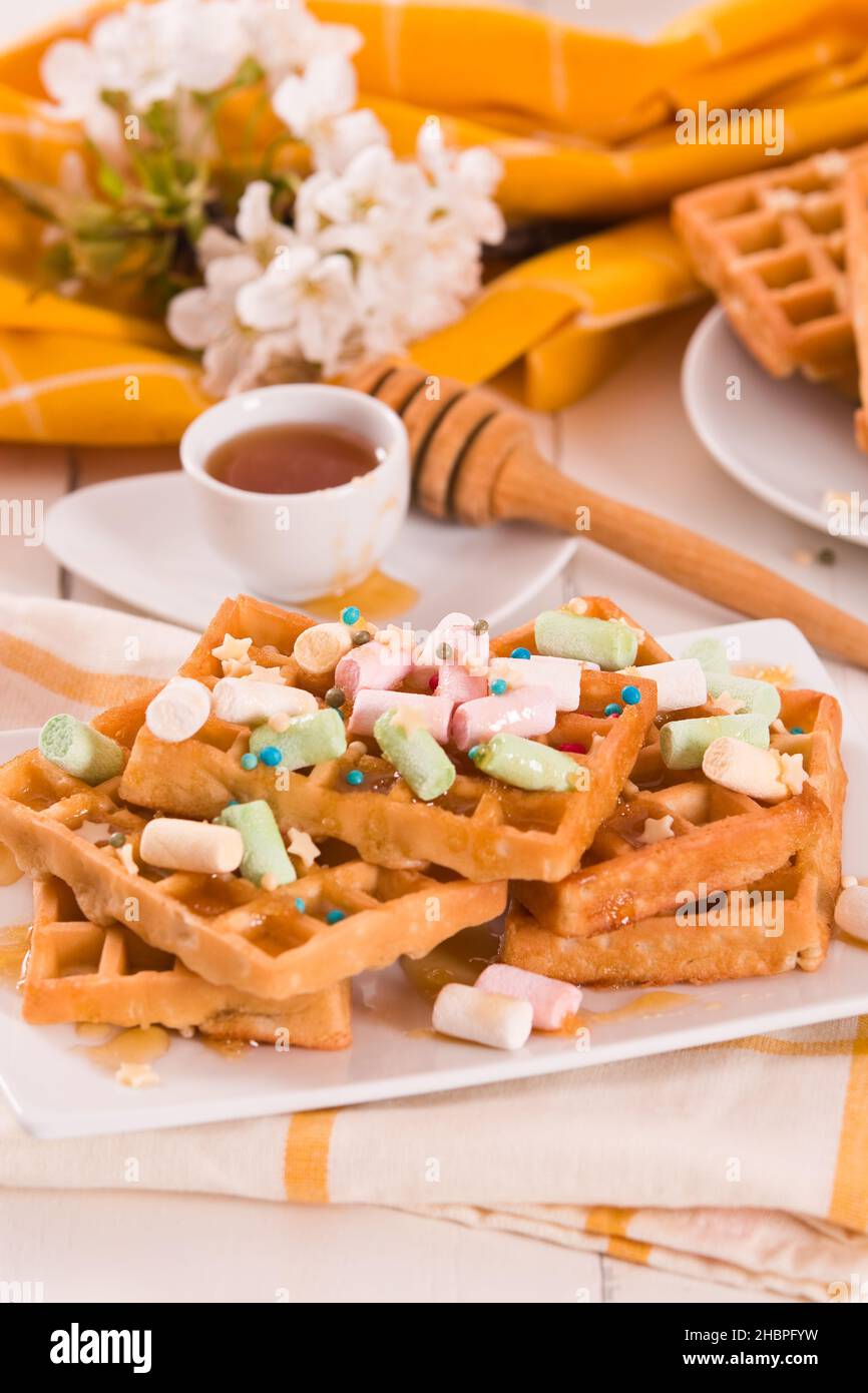 Waffles with colourful marshmallow Stock Photo - Alamy