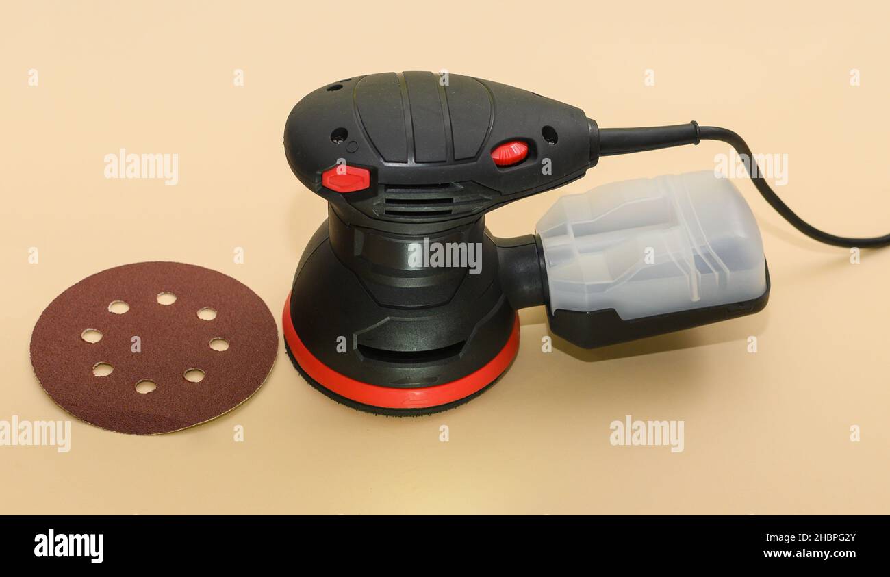 Eccentric orbital grinding machine and grinding wheel Stock Photo - Alamy