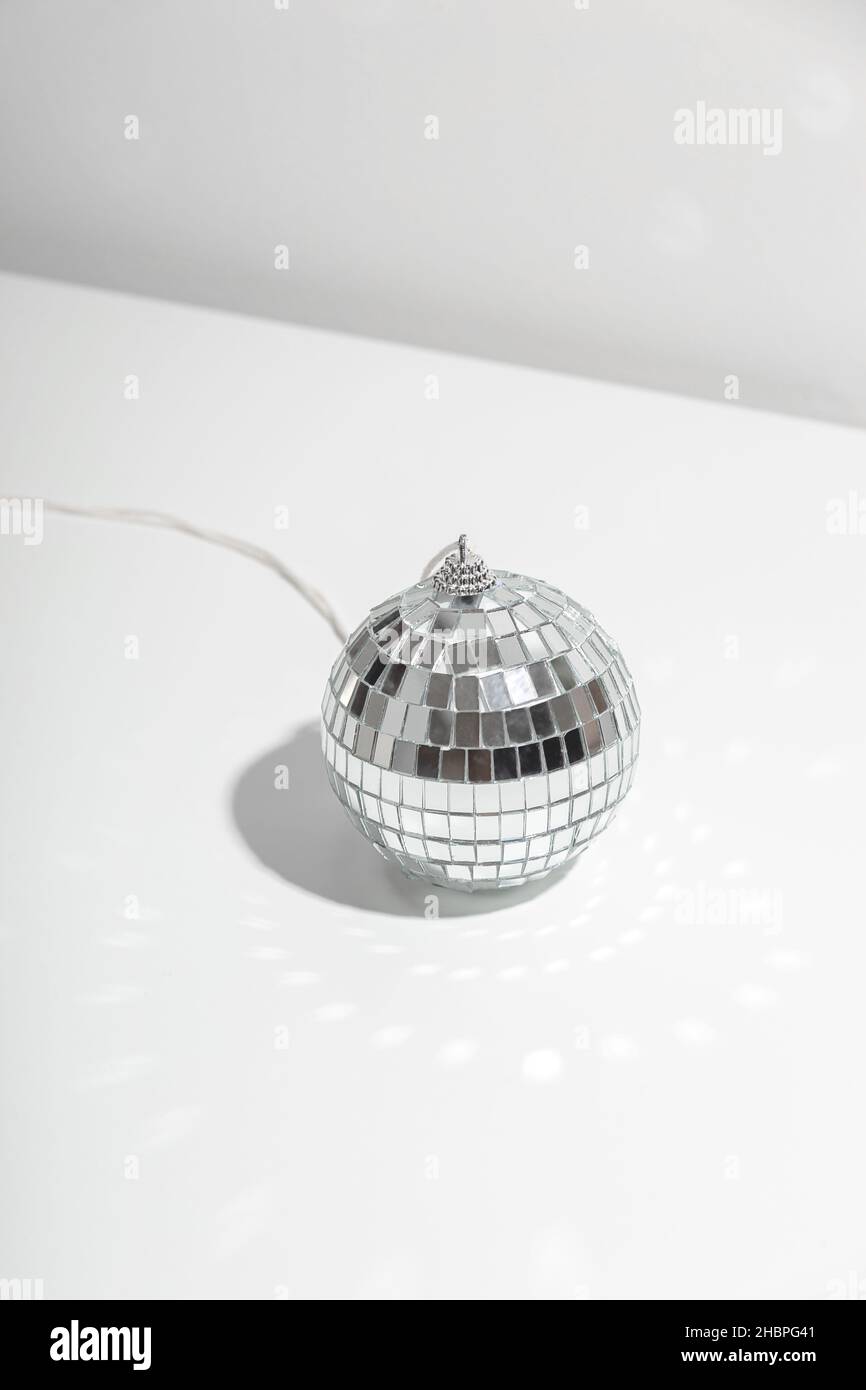 Gray disco ball lies on silver background with shadow Stock Photo - Alamy
