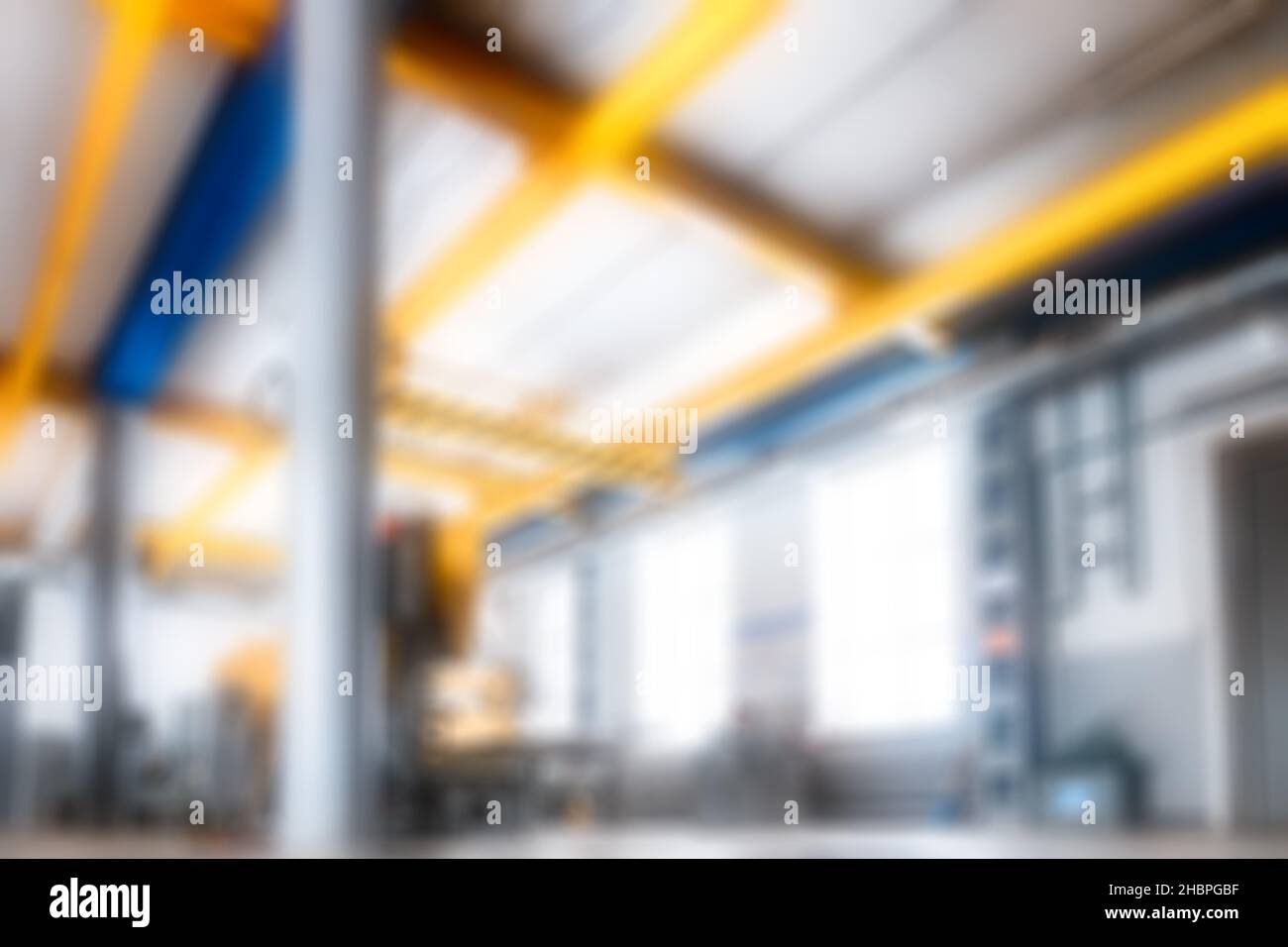 Empty production room in factory. Unfocused backdrop is industrial ...