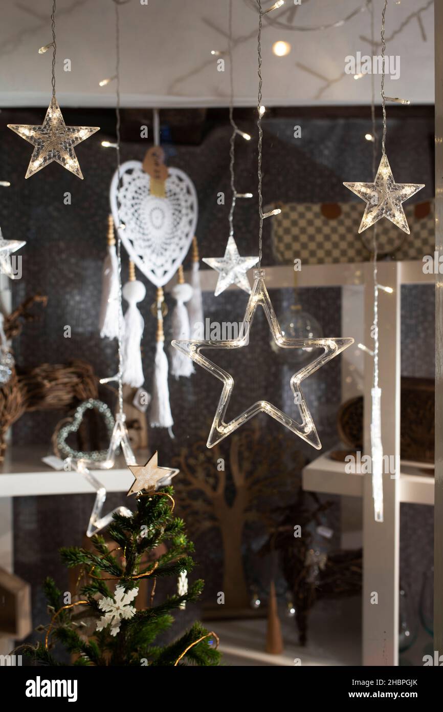 Christmas Star decorations in a shop winow along Middle Row at night ...
