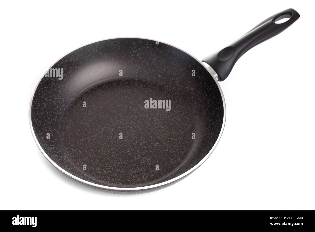 empty frying pan with non-stick coating and black handle on white ...