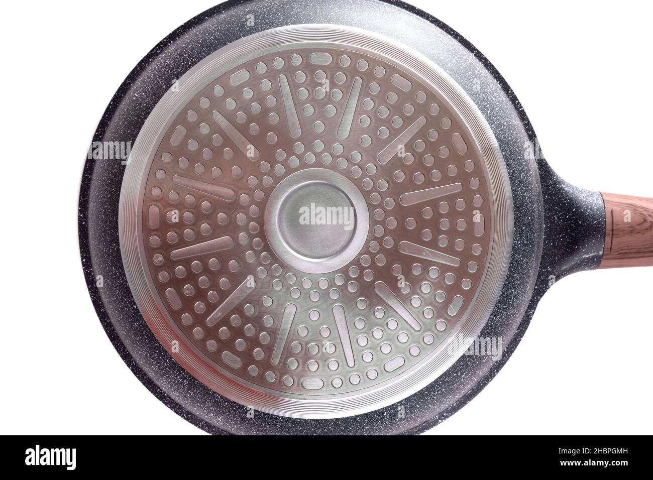 embossed bottom of the bottom of a metal frying pan with a brown handle ...