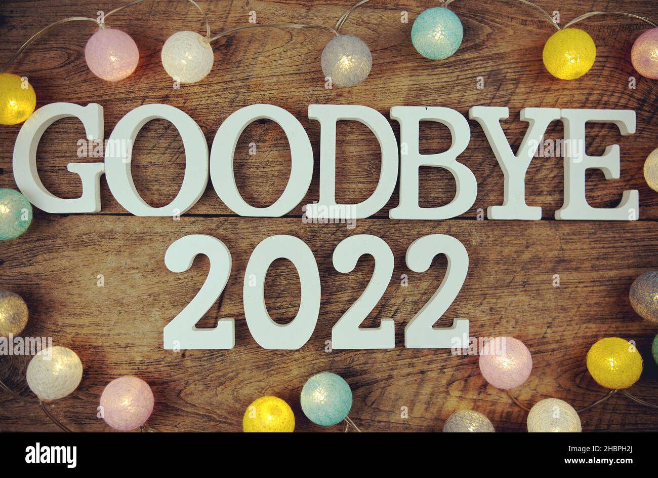 Goodbye 2022 alphabet letters and LED cotton ball decoration on wooden ...