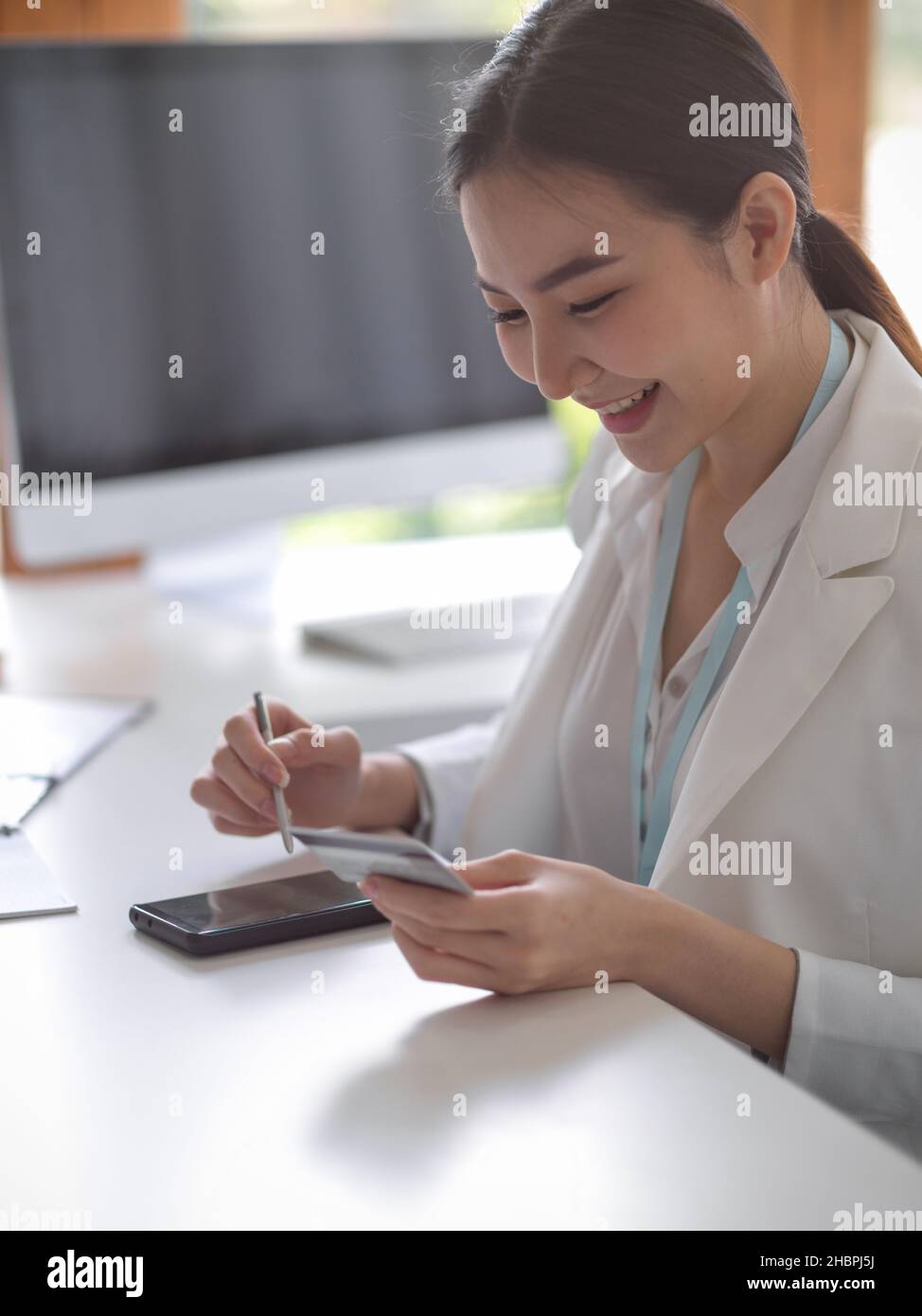 A portrait of a beautiful business woman checking her payroll on a ...