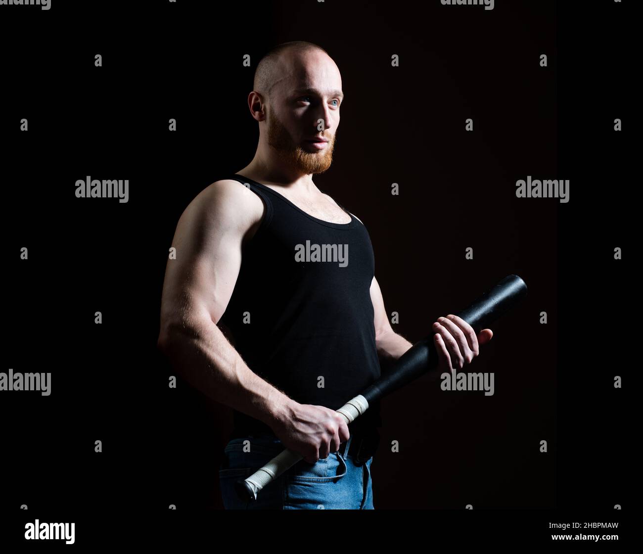 Brutal man with baseball bat for fighting, serious face of handsome ...