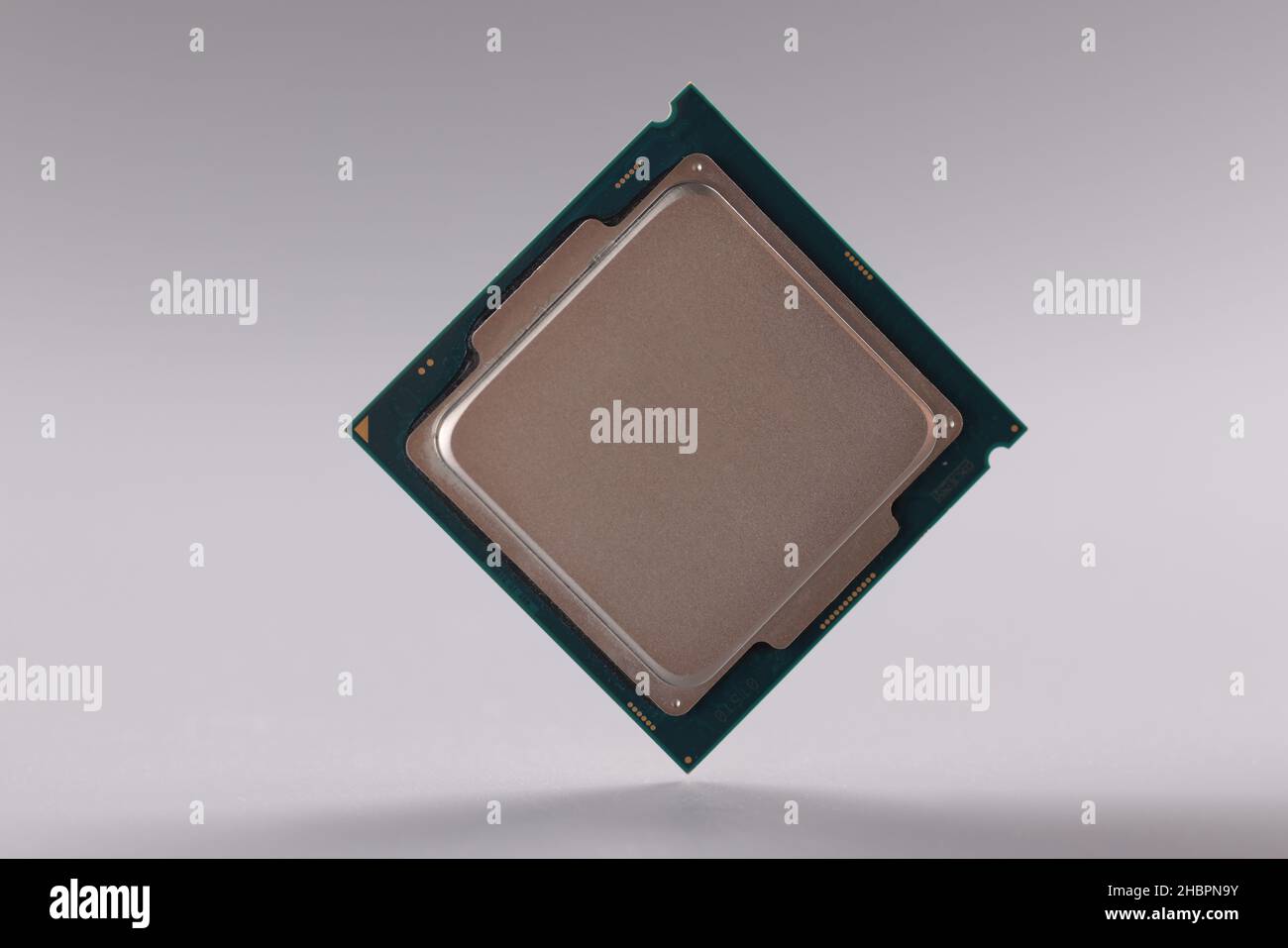 Tiny central processing unit, processor chip on grey background Stock ...