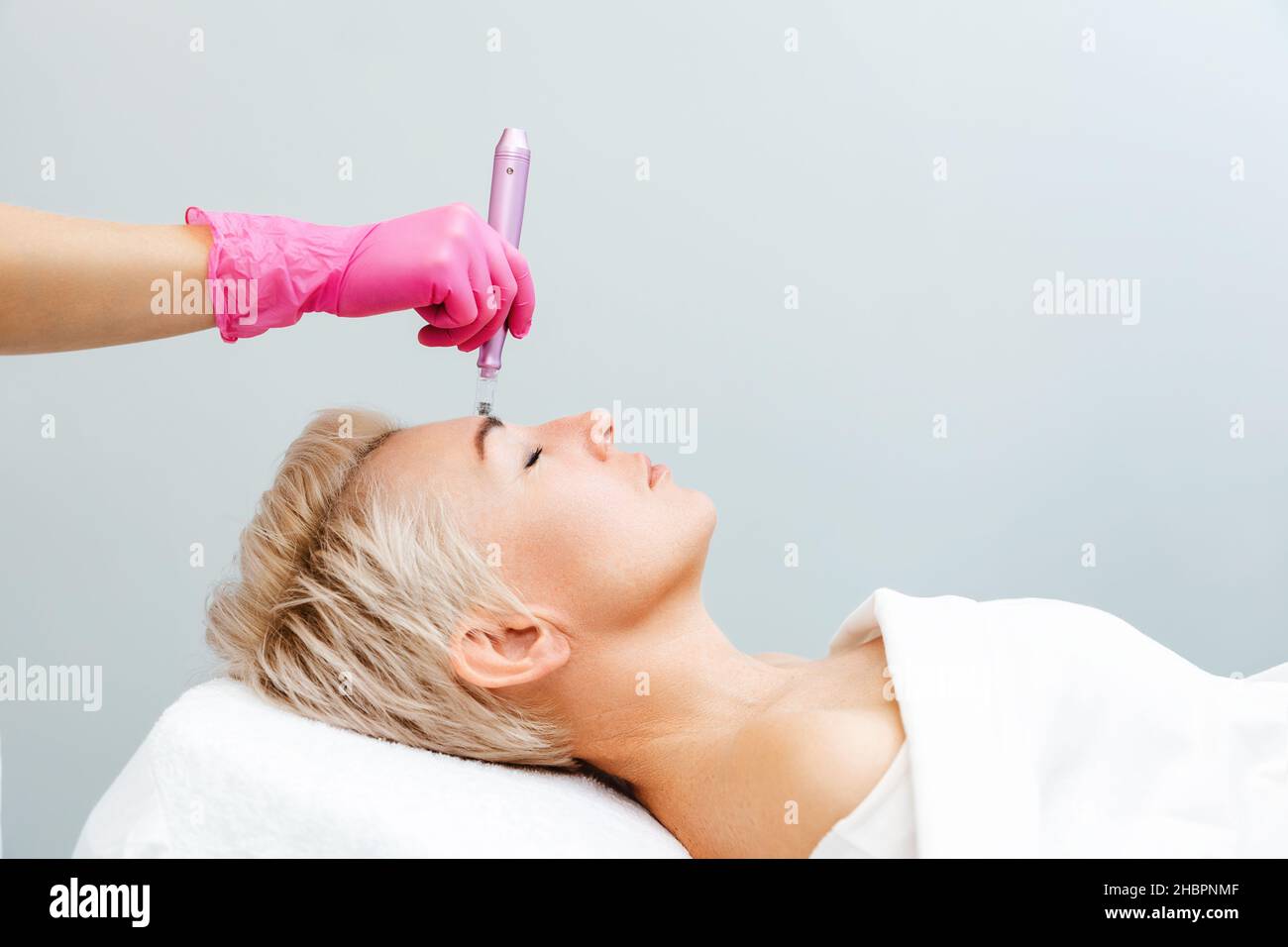 Adult woman at a mesotherapy session in a professional clinic of ...