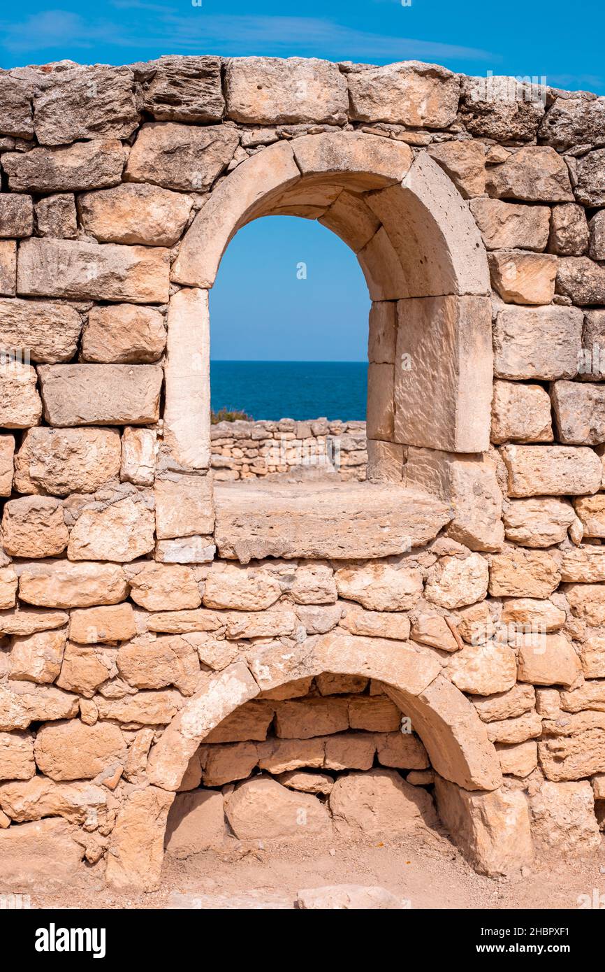antique stone wall with arched opening and sea view Stock Photo - Alamy