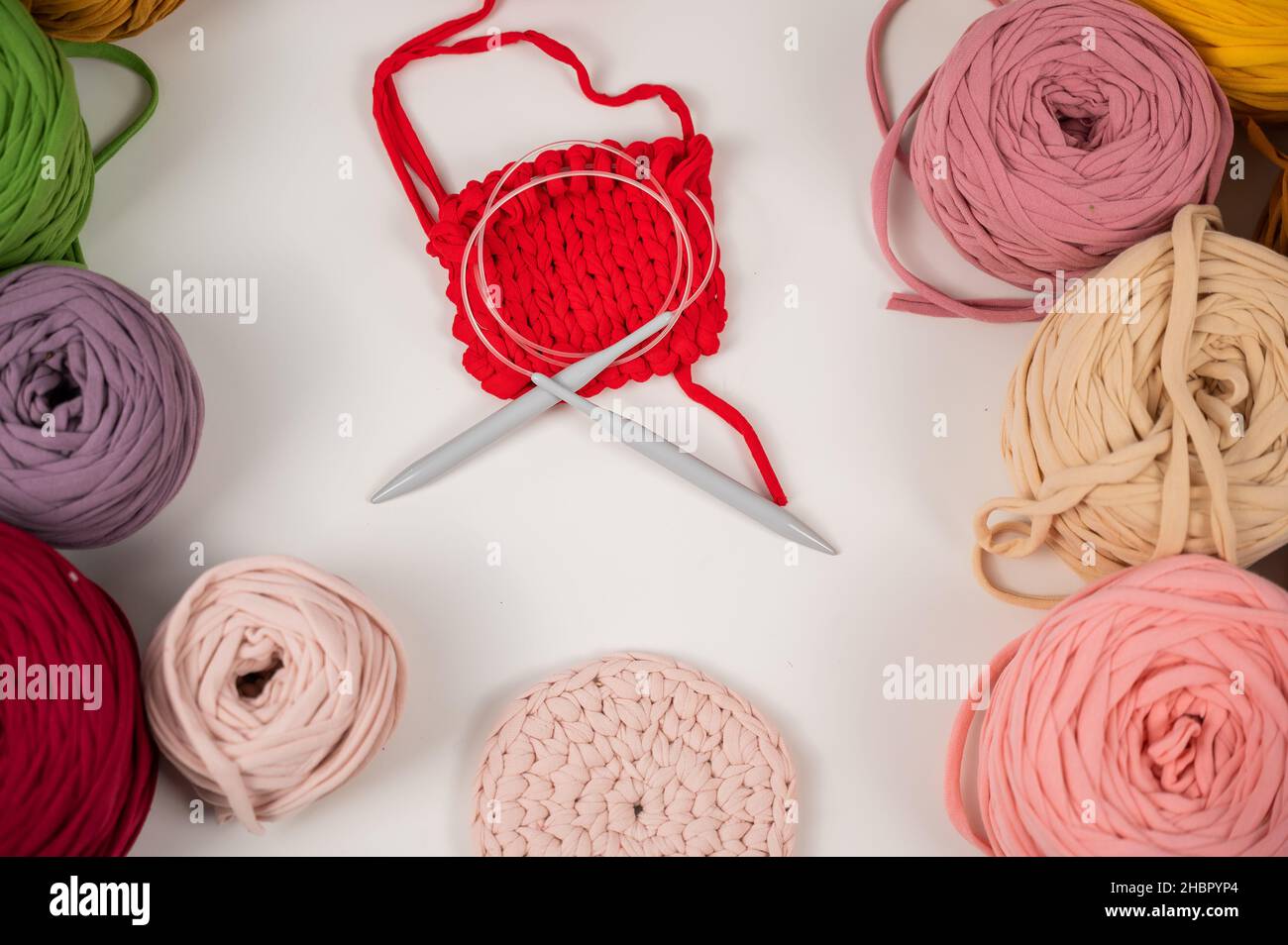 cotton yarn knitting pattern on white table Stock Photo - Alamy