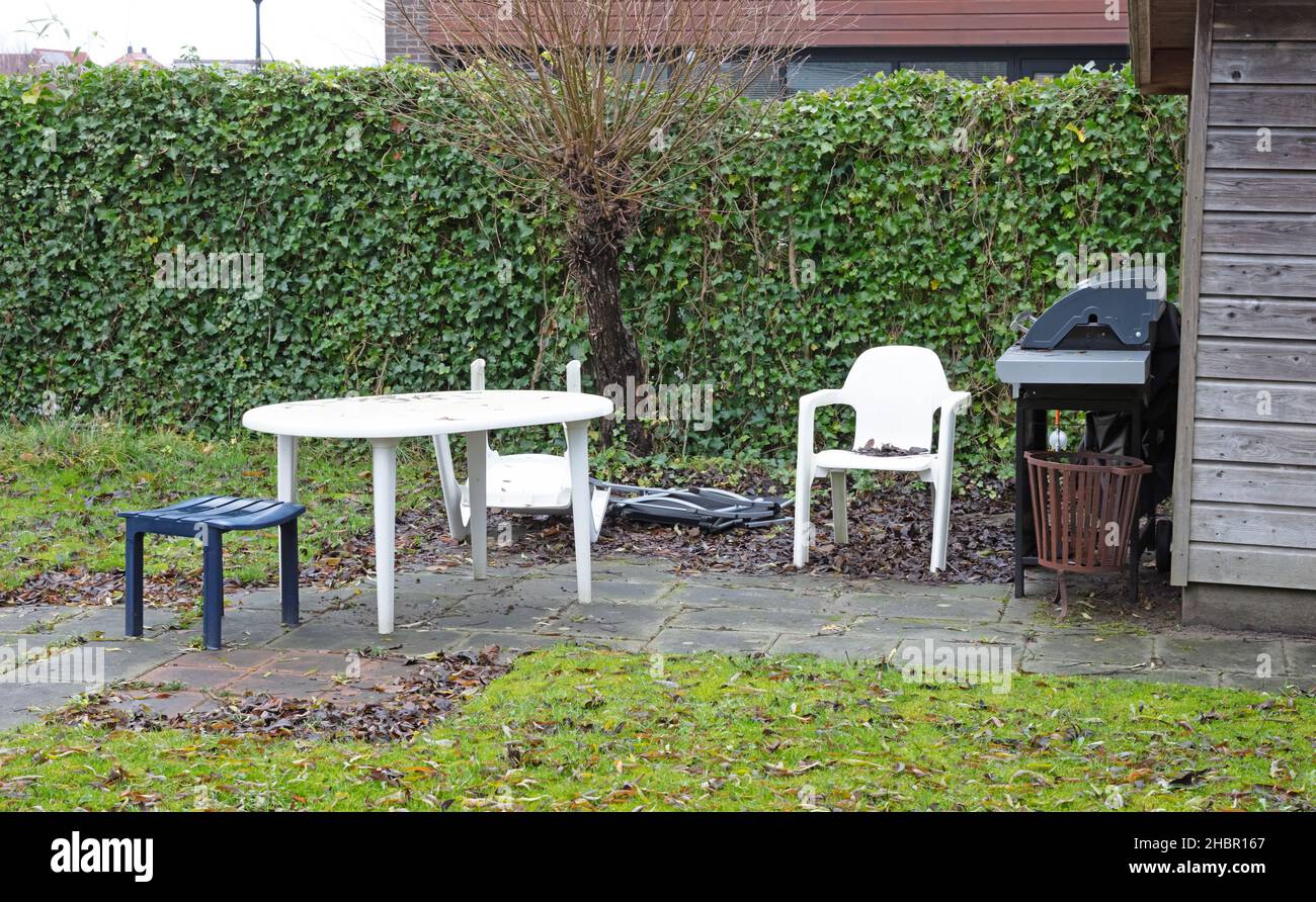 Storm in a garden, chair blown away, the Netherlands Stock Photo - Alamy