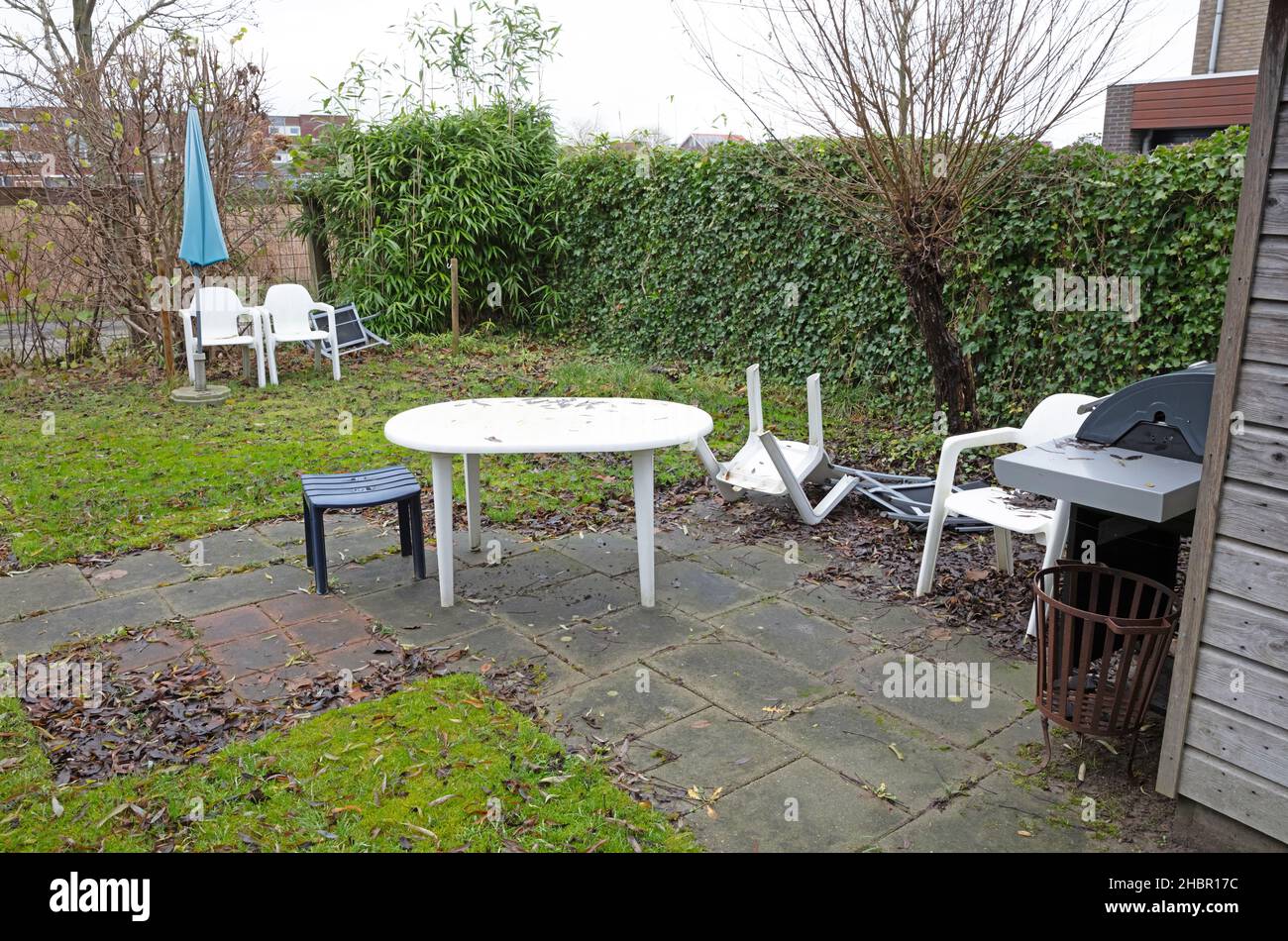 Storm in a garden, chair blown away, the Netherlands Stock Photo - Alamy