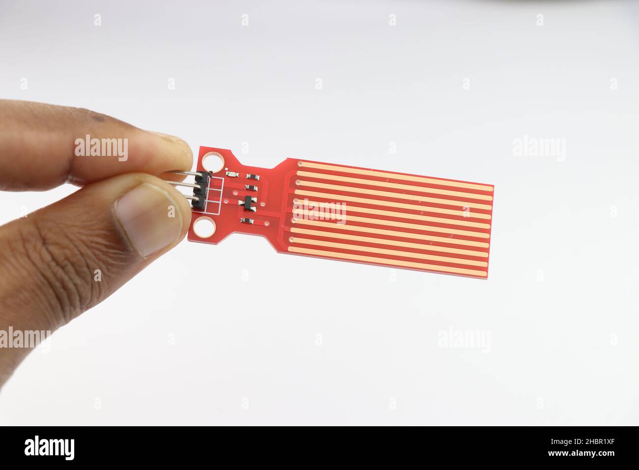 Water Level Depth Detection Sensor held in hand isolated on white ...