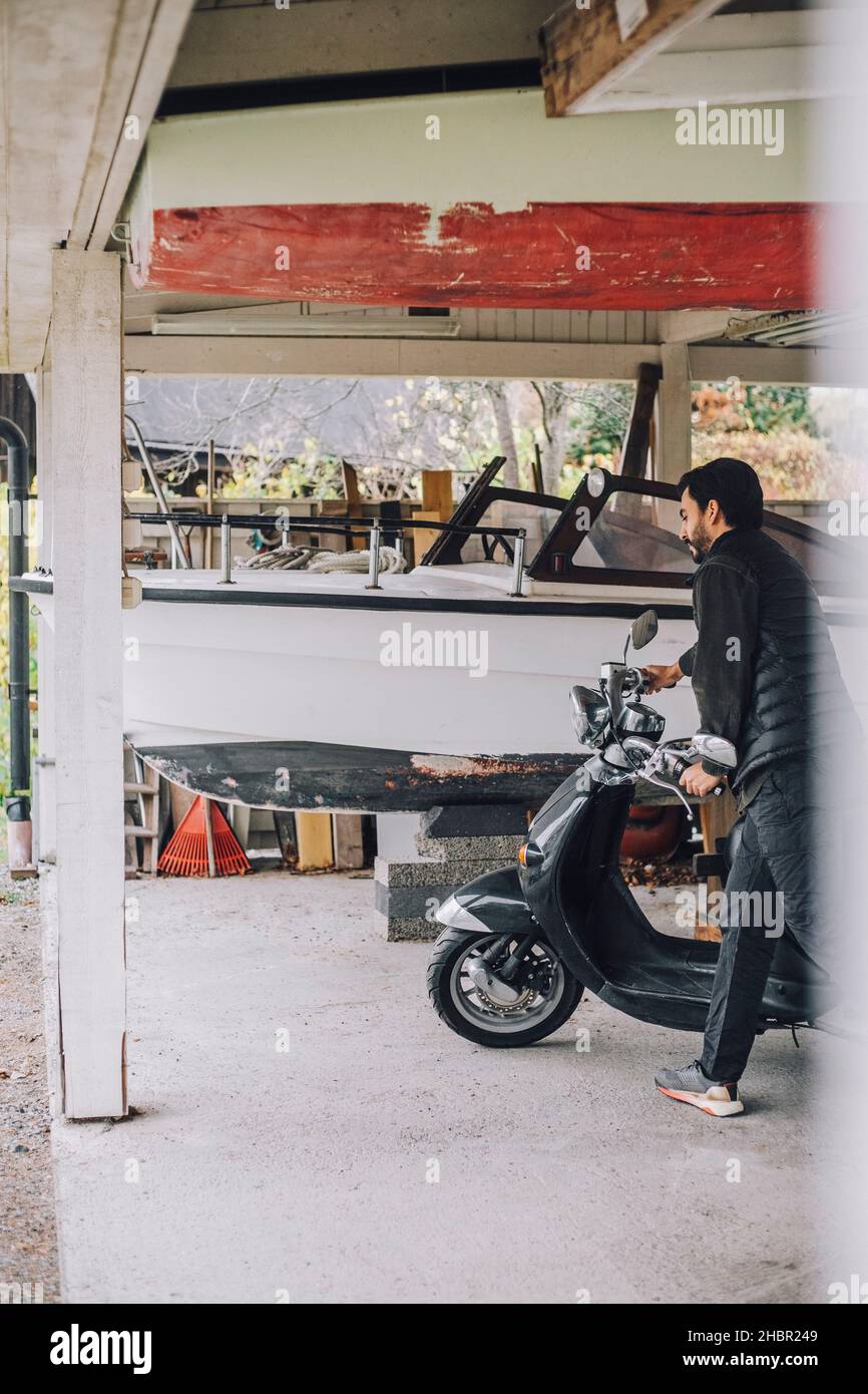 Adult on scooter hi-res stock photography and images - Alamy