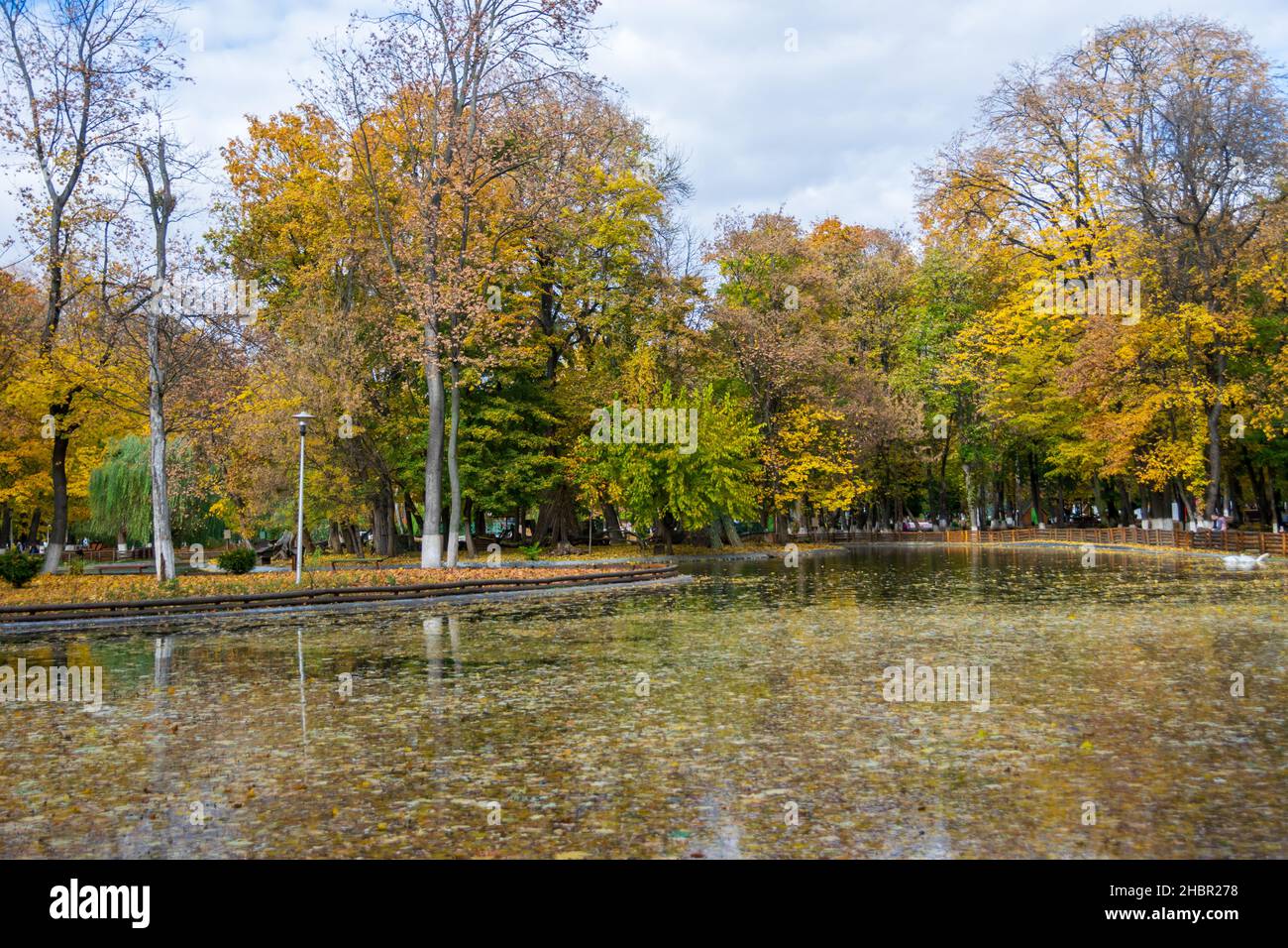 The lake from the Roman park in the autumn surrounded by colored trees ...