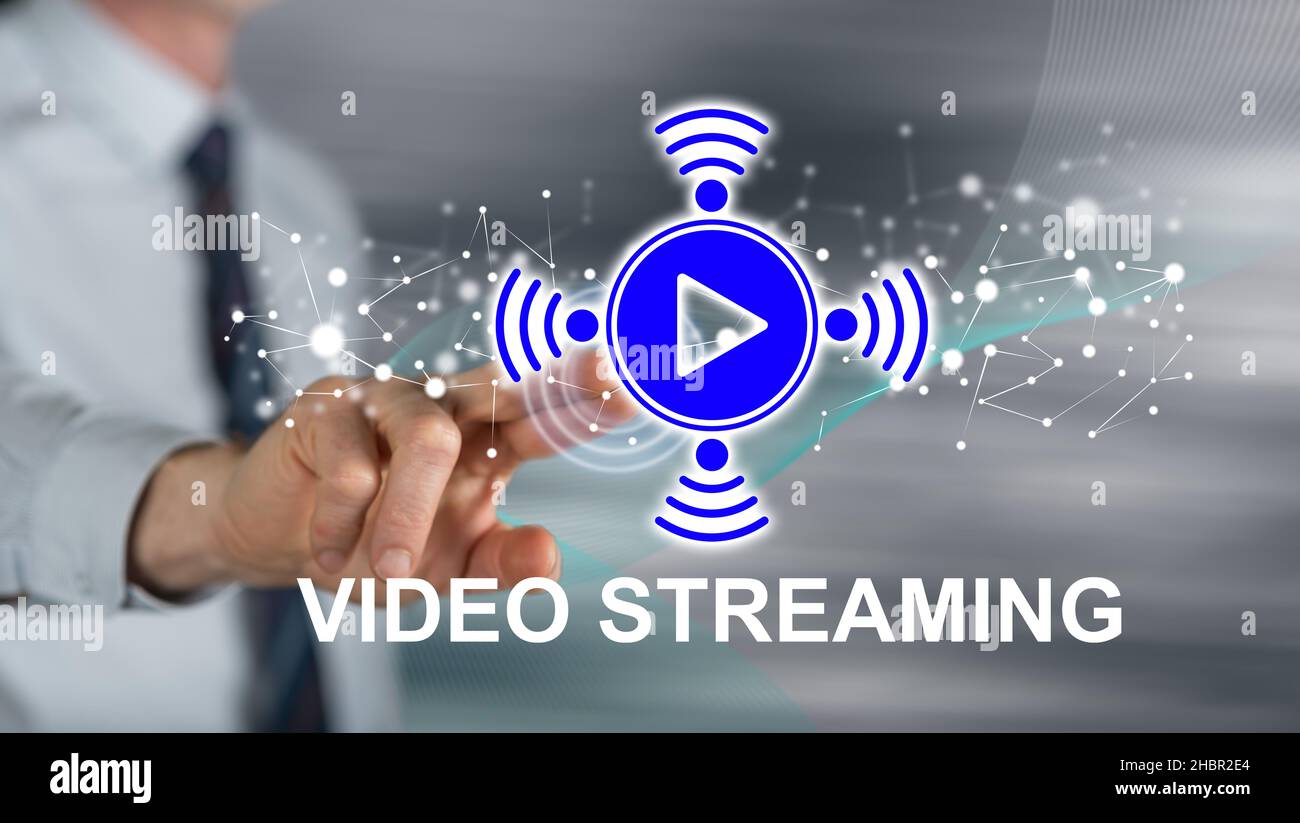 Man touching a video streaming concept on a touch screen with his ...